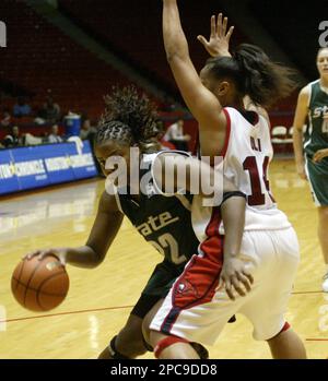 Michigan State's Aisha Jefferson, left, is fouled by Iowa's Megan ...