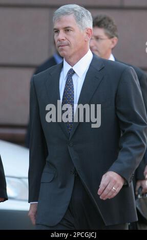 Former Enron executive Andrew Fastow, left, leaves the federal court in ...