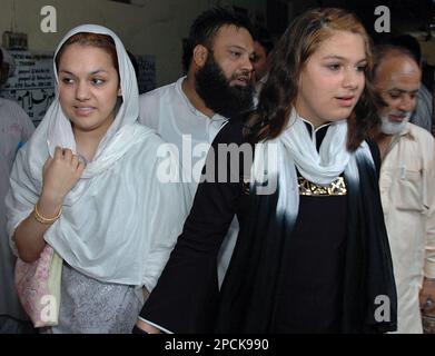 Sajad Ahmed Rana, center, father of Scottish girl Molly Campbell, also ...