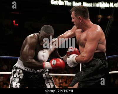 Oleg Maskaev, right, of Karaganda, Kazakhstan, connects to the face of ...