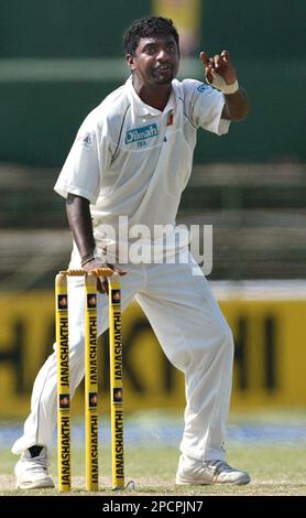 Sri Lankan bowler Muttaiah Muralitharan, center, celebrates the wicket ...