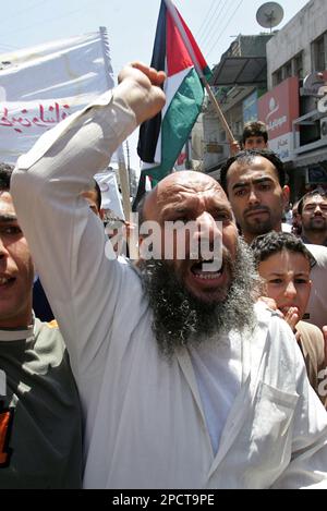 A Jordanian protester shouts slogans against the al-Qaida group during ...