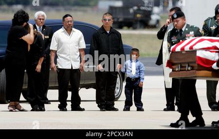 Christina Menchaca, 18, left, is comforted after family members placed ...