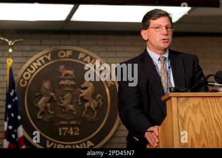 Two Fairfax County, Va. police officer ride their motorcycles past the ...