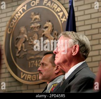 Two Fairfax County, Va. police officer ride their motorcycles past the ...