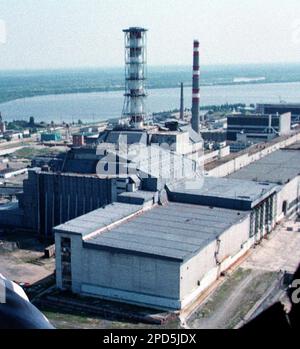 A chimney over the destroyed reactor at the Chernobyl nuclear power ...
