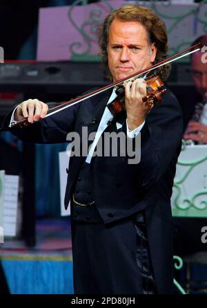 Dutch "pop" violinist Andre Rieu performs with his orchestra on stage ...