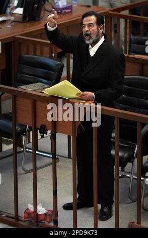 Chief judge Raouf Rashid Abdel-Rahman listens to testimony from Ali ...