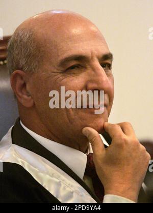 Chief judge Raouf Rashid Abdel-Rahman listens to testimony from Ali ...