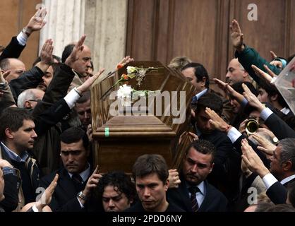 People greet the coffin of Romano Mussolini with fascist salutes ...