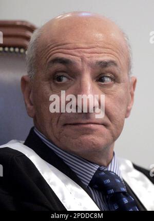 Chief judge Raouf Rashid Abdel-Rahman listens to testimony from Ali ...