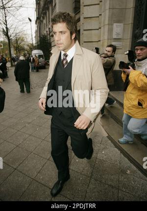 Former soccer referee Robert Hoyzer, left, and his attorney, right ...