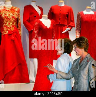 A display of red gowns, dresses and suits worn by first ladies since ...