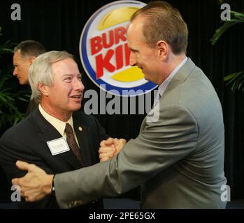 Greg Brenneman, chairman and CEO of the Burger King Corp. makes a ...