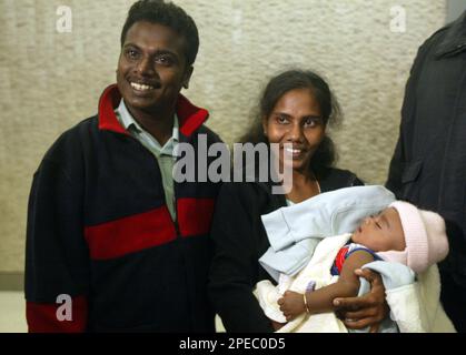 Abilass Jeyarajah, popularly known as 'Baby 81", is held by his mother ...