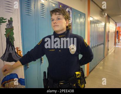 St. Paul police officer Julie Maidment wears her new Taser gun at ...
