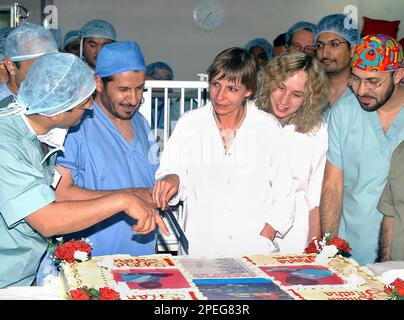 Twin Polish girls Olga, second left, and Daria Kolacz, right, dressed ...