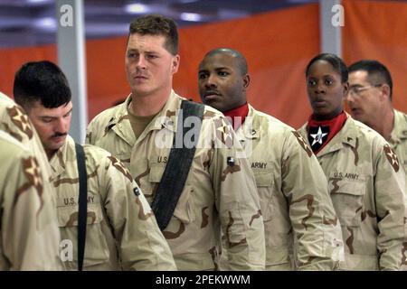 U.S. Marines pay their final respects at a memorial service for 1st ...