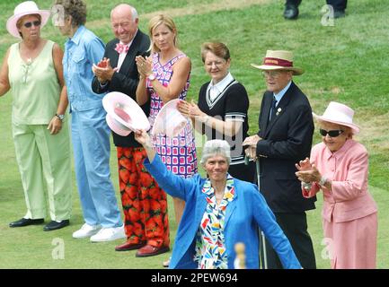 Tennis great Shirley Fry-Irvin of the U.S. waves her hat to the crowd ...