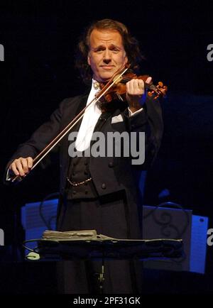 Dutch "pop" violinist Andre Rieu performs with his orchestra on stage ...