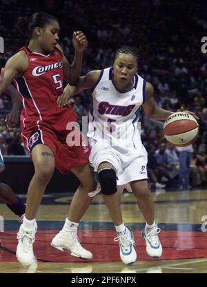 Houston Comets guard Dawn Staley, left, drives past Charlotte Sting ...