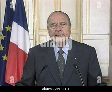 The image of French President Jacques Chirac is projected on a screen ...