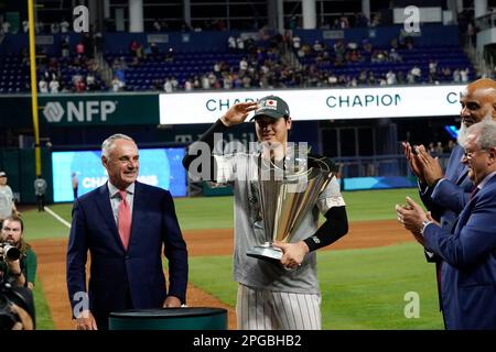 Japan's Shohei Ohtani receives a trophy after winning the World ...