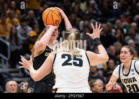 Colorado guard Frida Formann, left, goes up for a shot against Iowa ...