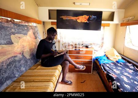 Zimbabwean artist Nothando Chiwanga works on her latest piece in Harare ...