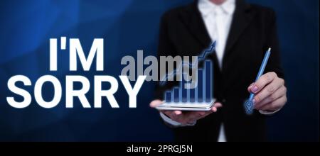 Das Schild zeigt "Ich bedaure", "Geschäftsidee", um jemanden um ...