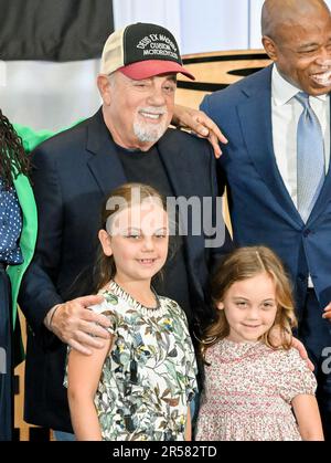Billy Joel, left, poses with daughters and wife Alexis Roderick and New ...