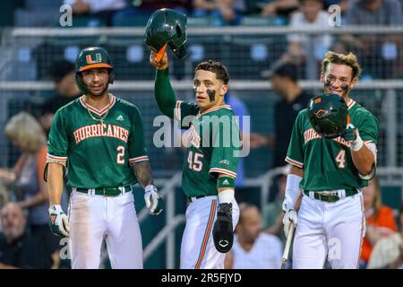 Miami Hurricanes infielder Blake Cyr (4) and outfielder Edgardo ...