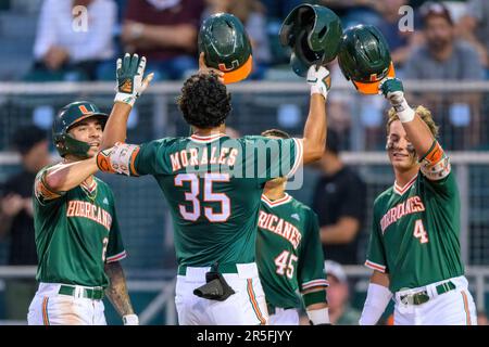 Miami Hurricanes infielder Blake Cyr (4) and outfielder Edgardo ...