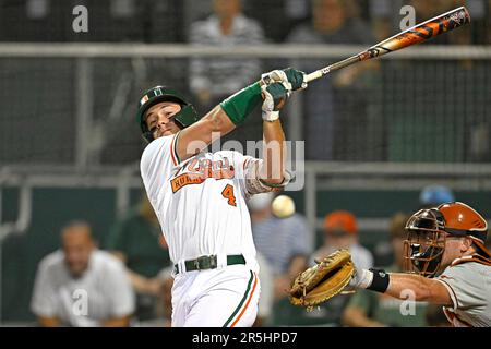 Miami Hurricanes infielder Blake Cyr (4) and outfielder Edgardo ...