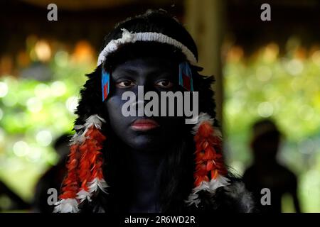 An Indigenous girl prepares to take part in a ritual during the final ...