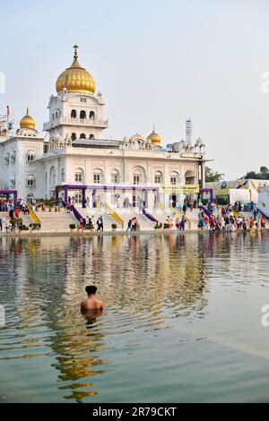 Sikh devotees pray at the Gurudwara Bangla Sahib, a Sikh temple, to ...