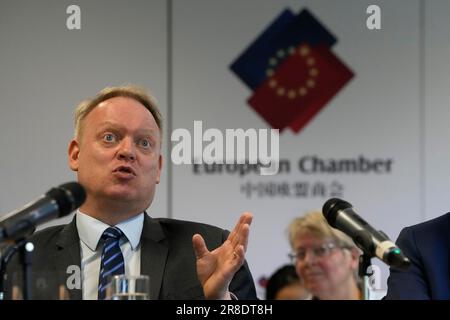 Jens Eskelund, President, European Chamber drinks from a cup at the ...