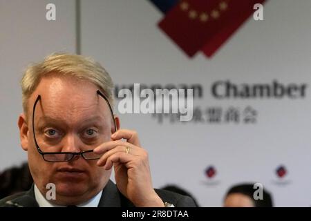 Jens Eskelund, President, European Chamber drinks from a cup at the ...