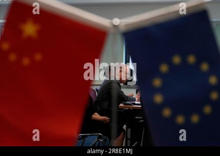 Jens Eskelund, President, European Chamber drinks from a cup at the ...