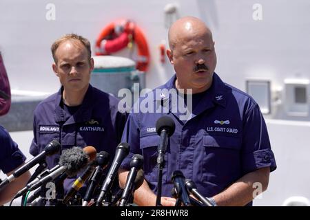 U.S. Coast Guard Capt. Jamie Frederick, left, faces reporters as Paul ...