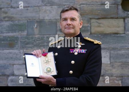 Lieutenant General Sir Nicholas Borton holds his medal after being made ...