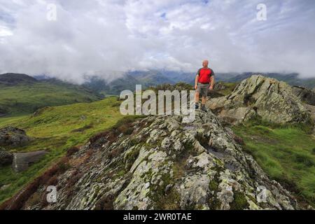 Walker at the Summit Cairn of Grange Fell on the Watendlath Fells, Lake ...