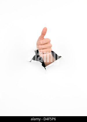 Hand zu brechen durch das Weißbuch mit Fingerzeig auf die Sie Stockfoto ...