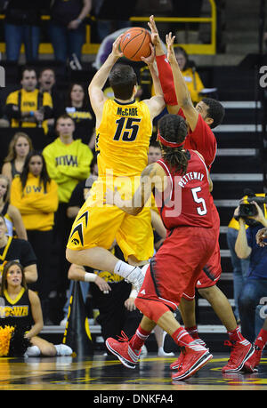 Iowa forward Zach McCabe (15) fights for a rebound with South Dakota ...