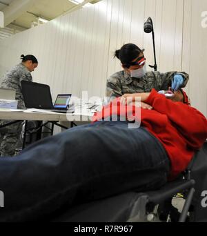 U.S. Coast Guard Capt. Jamie Frederick, left, faces reporters as Paul ...
