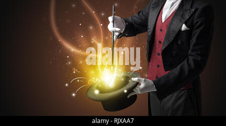 Magier Hand zaubern mit Zauberstab Licht von einem schwarzen Zylinder ...