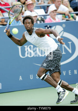 Igor Andreev of Russia returns the ball to Gael Monfils of France at ...