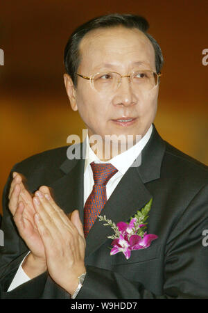 Chen Xiaoxian, President of China CITIC Bank, right, leaves a hotel ...
