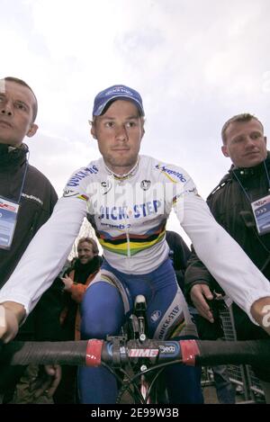 Belgium's Tom Boonen of the Quick Step team, center, poses with ...