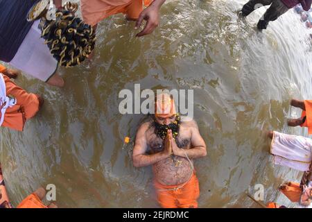 A Sadhu, or Hindu holy man Mauni Baba, offers prayers at the Sangam ...